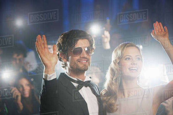 Well dressed celebrity couple waving to paparazzi - Royalty-free Stock ...