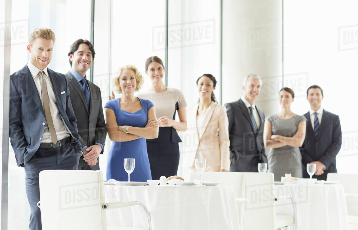Business people smiling in restaurant - Royalty-free Stock Photo | Dissolve