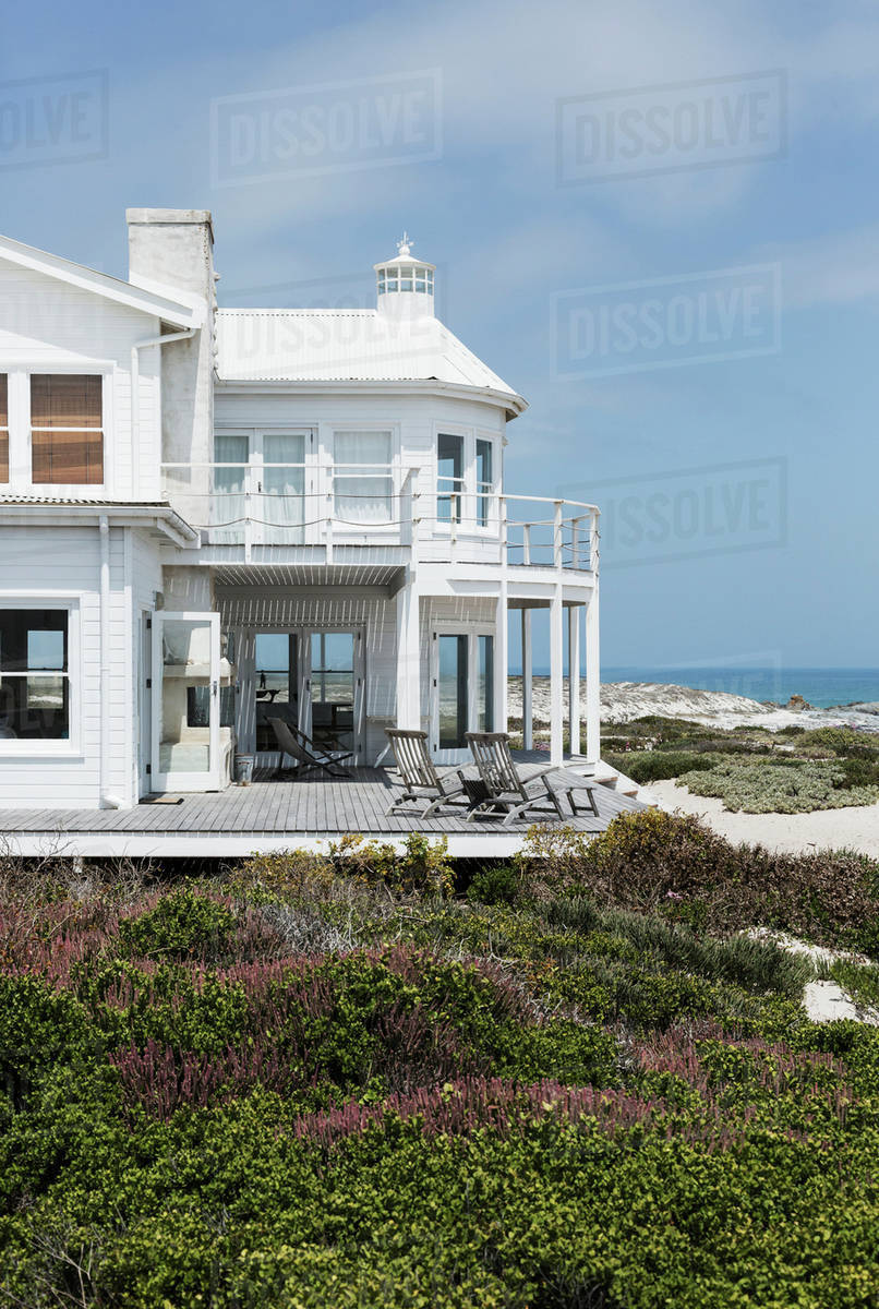 Beach house overlooking ocean - Royalty-free Stock Photo | Dissolve