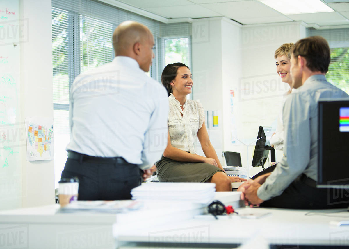 Business people talking in office - Royalty-free Stock Photo | Dissolve