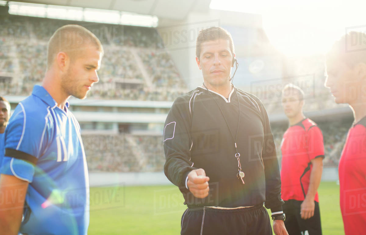 Referee tossing coin during soccer game - Royalty-free Stock Photo ...