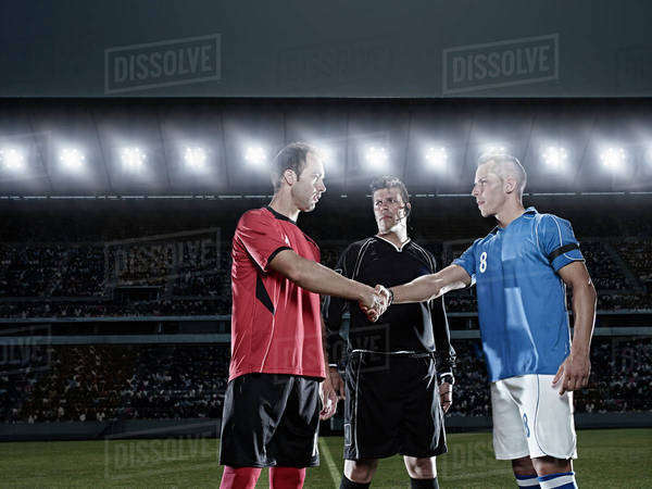 Soccer players shaking hands on field - Royalty-free Stock Photo | Dissolve