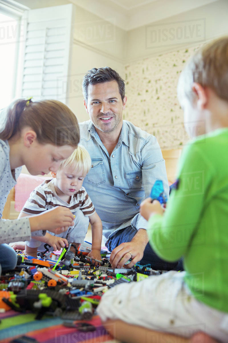 Father playing with children - Royalty-free Stock Photo | Dissolve