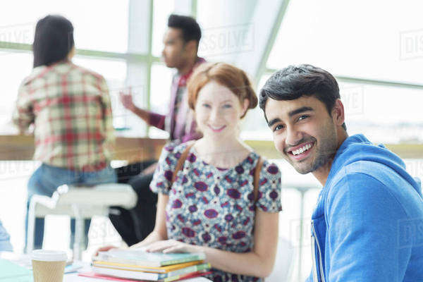 Students smiling in cafe - Stock Photo - Dissolve