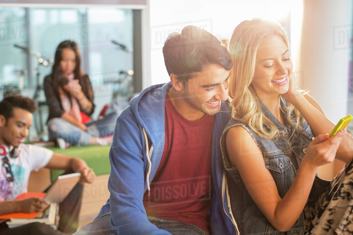 University students using cell phone in lounge - Royalty-free Stock ...