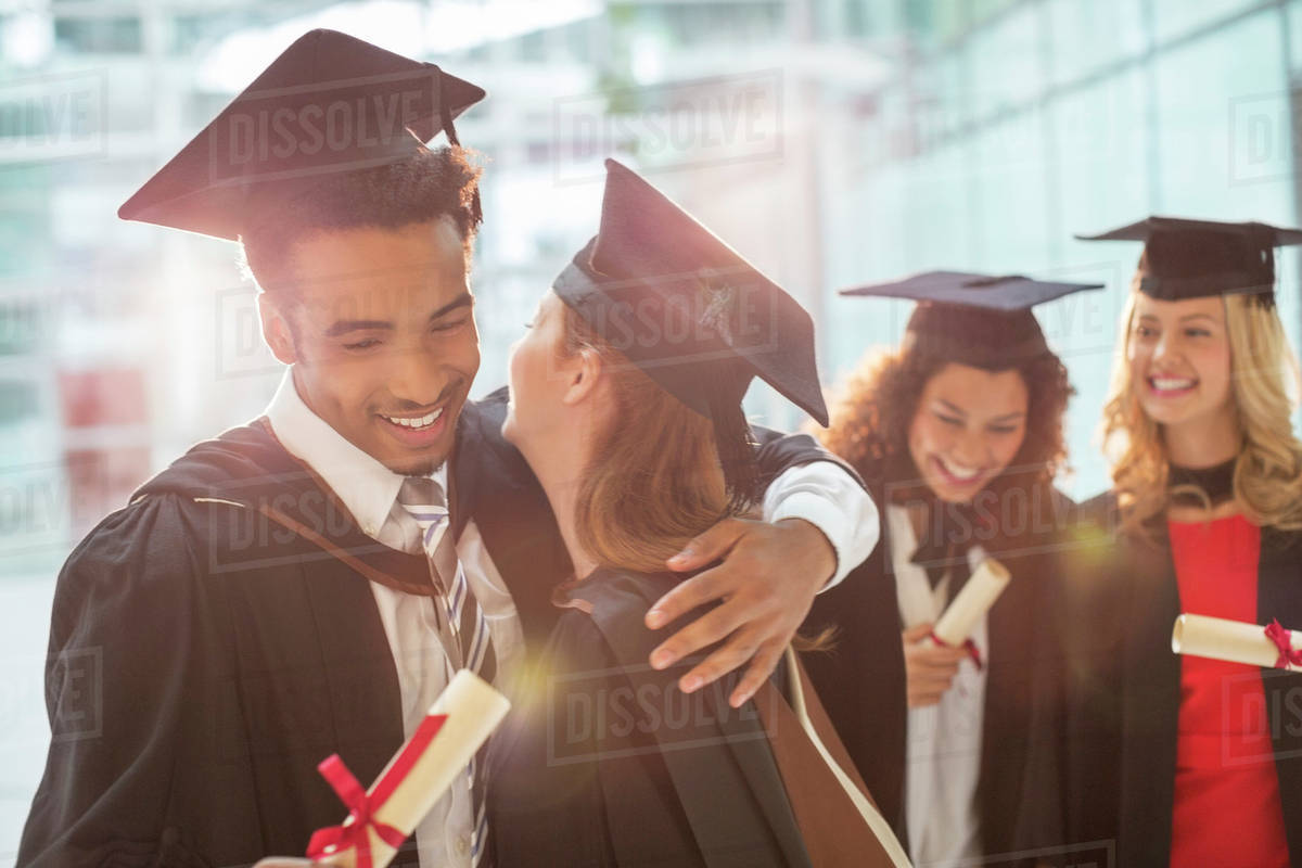 Graduates hugging - Royalty-free Stock Photo | Dissolve