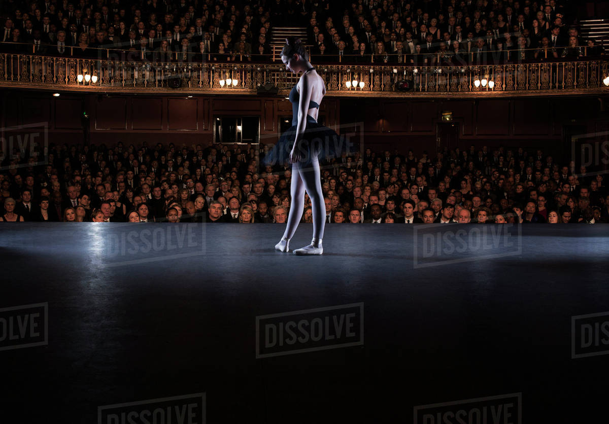 Ballet dancer performing on stage in theater - Stock Photo - Dissolve