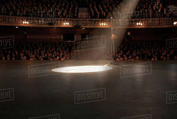 Spotlight shining on stage in theater - Stock Photo - Dissolve