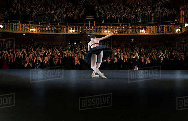 Ballerina bowing on stage in theater - Royalty-free Stock Photo | Dissolve