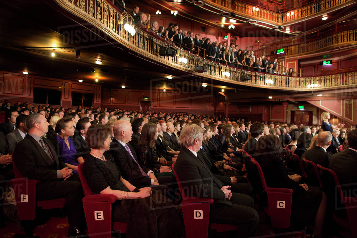Audience watching performance in theater - Stock Photo - Dissolve