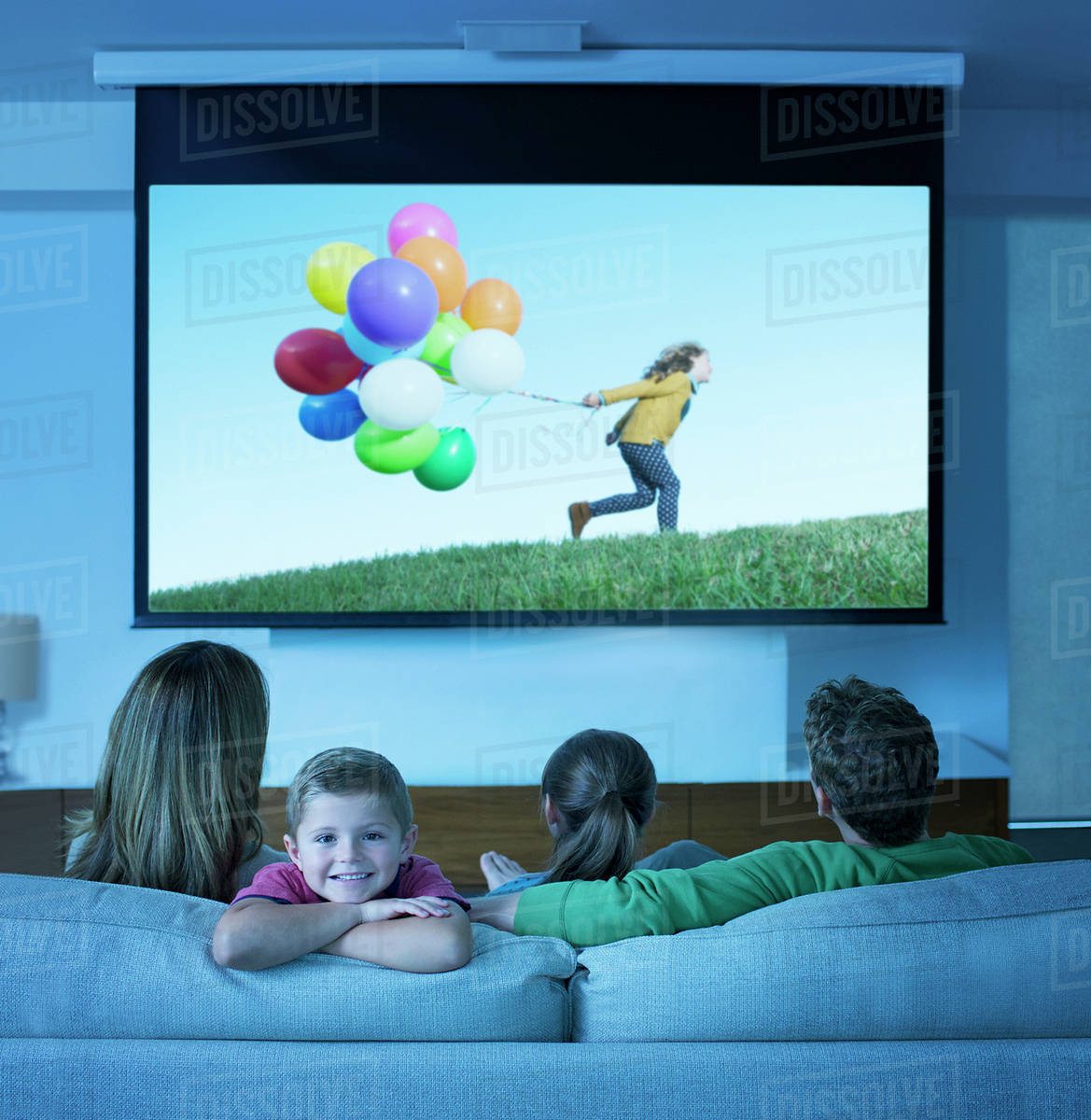 Family watching television in living room - Royalty-free Stock Photo ...