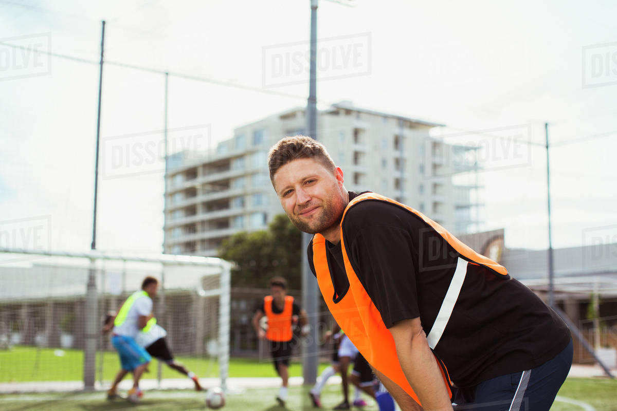 Soccer player smiling on field - Royalty-free Stock Photo | Dissolve