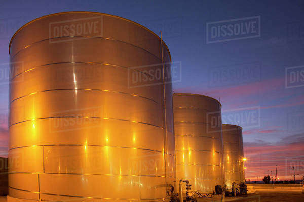 Silage storage tanks illuminated at night - Royalty-free Stock Photo ...