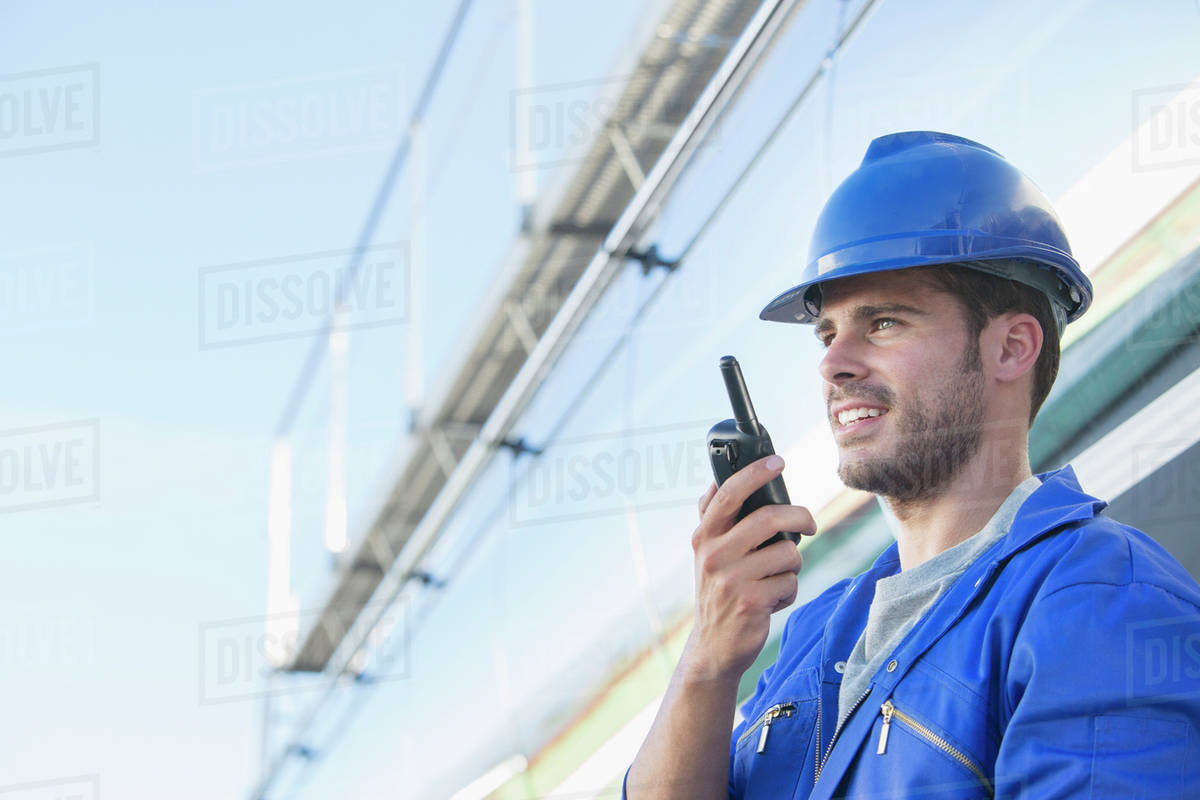 Worker using walkie-talkie - Royalty-free Stock Photo | Dissolve