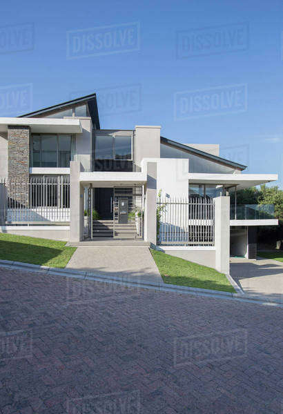 Modern house under blue sky - Royalty-free Stock Photo | Dissolve