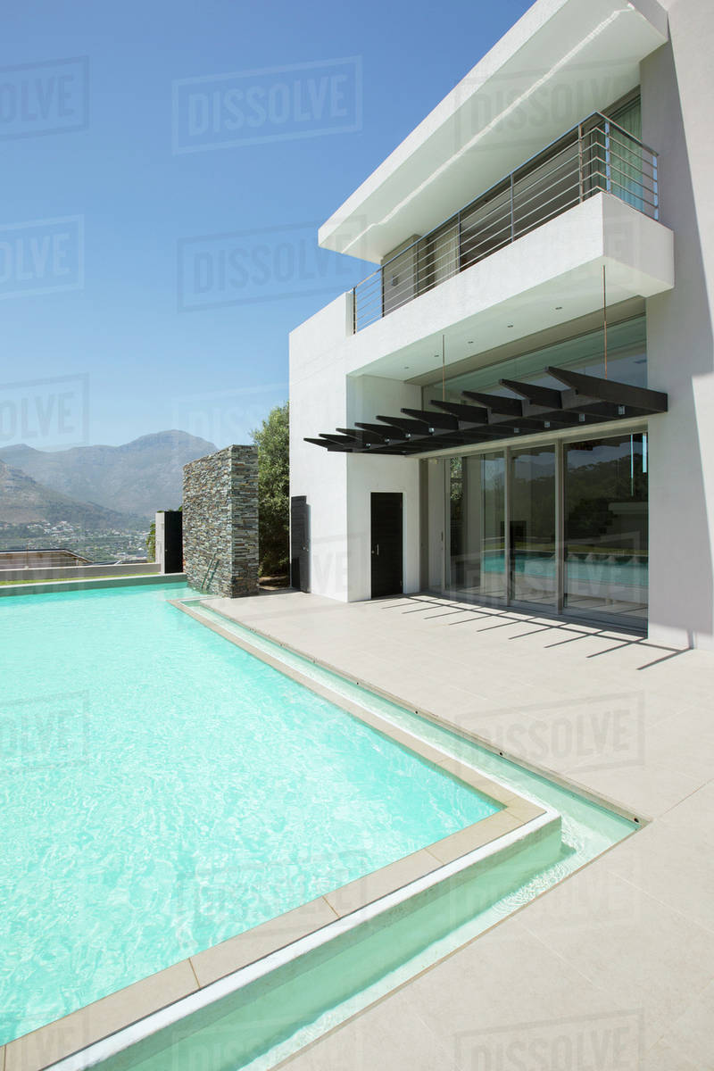 Modern house and swimming pool - Royalty-free Stock Photo | Dissolve