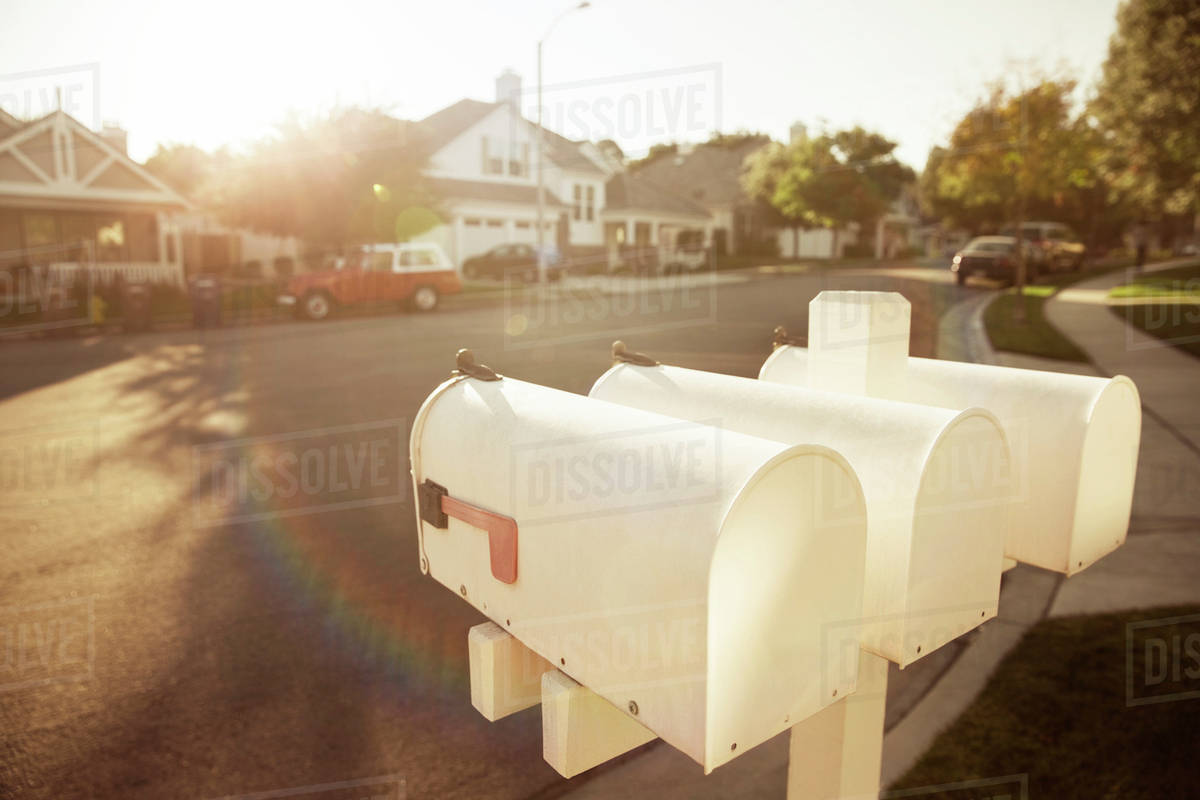 Mailboxes on suburban street - Stock Photo - Dissolve