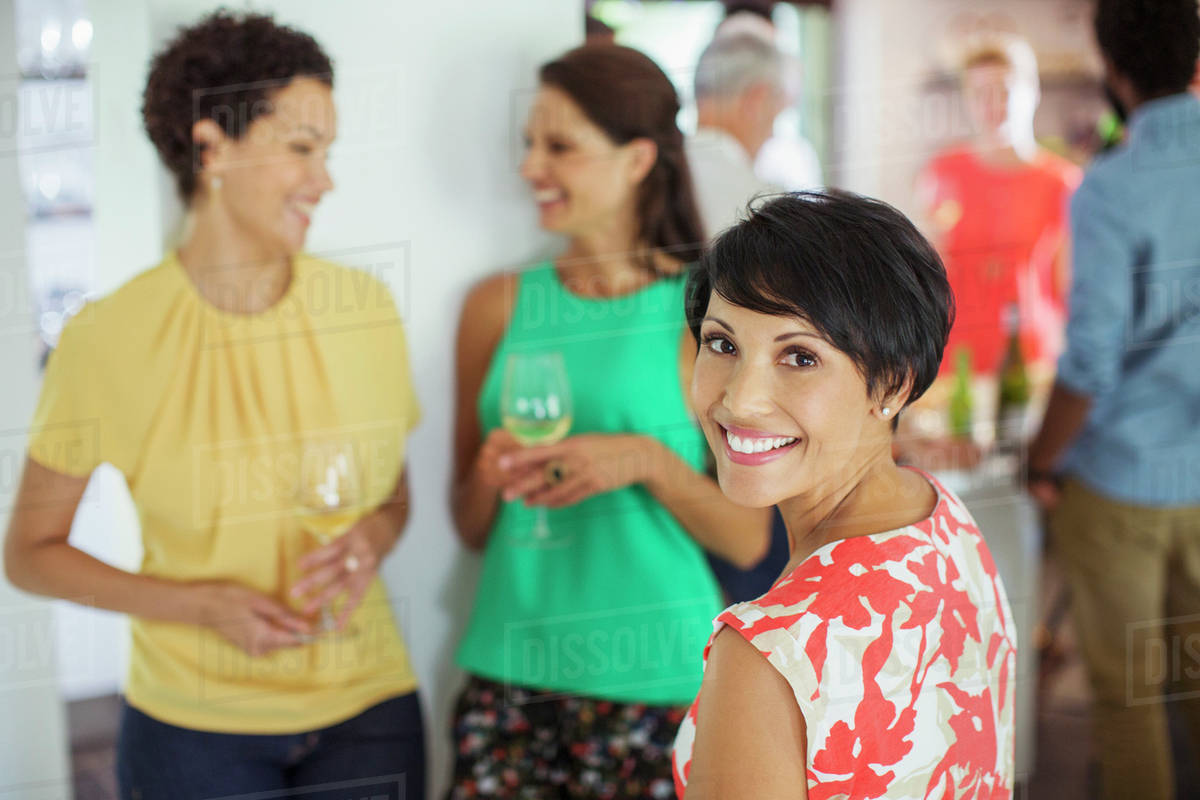 Woman smiling at party - Royalty-free Stock Photo | Dissolve