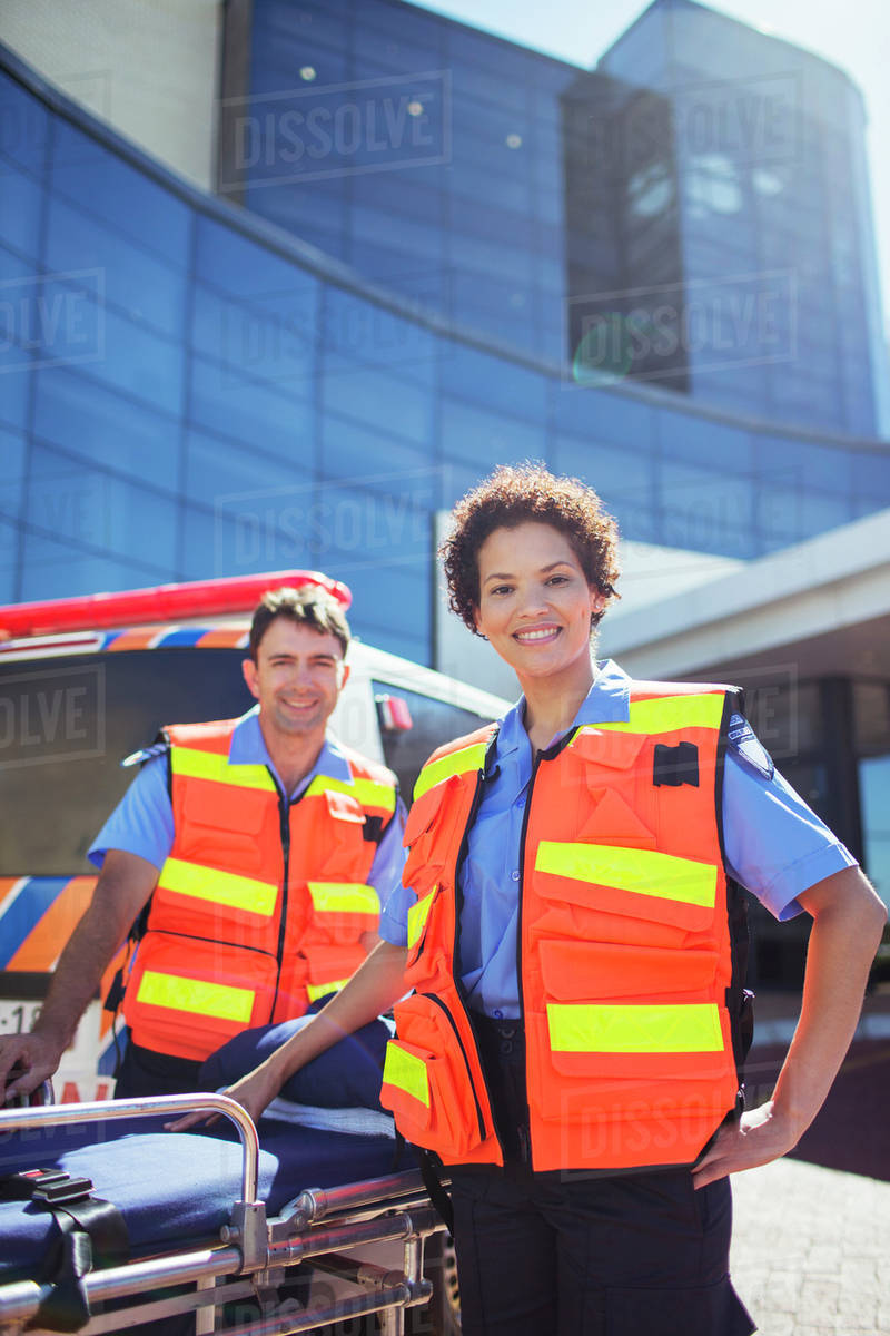 Paramedics smiling outside hospital - Royalty-free Stock Photo | Dissolve