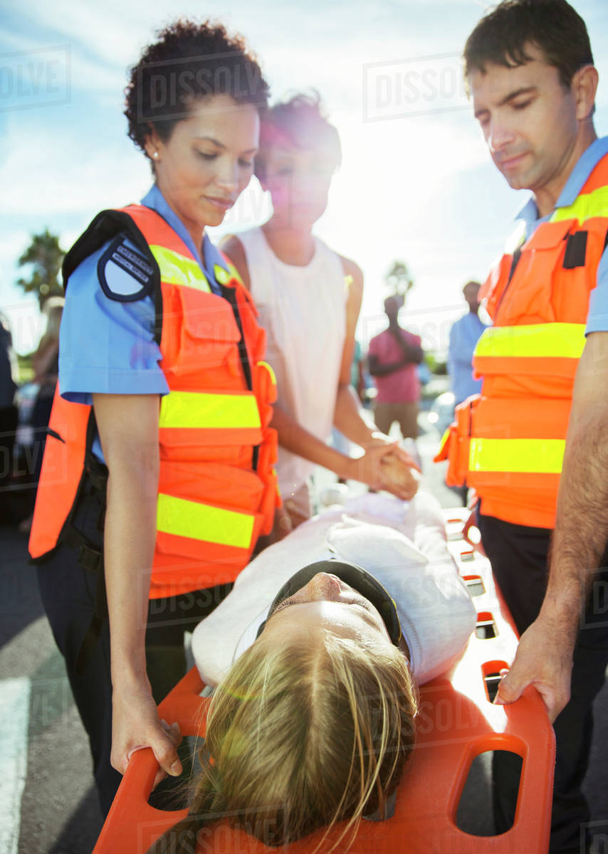 Paramedics carrying patient on stretcher - Royalty-free Stock Photo ...