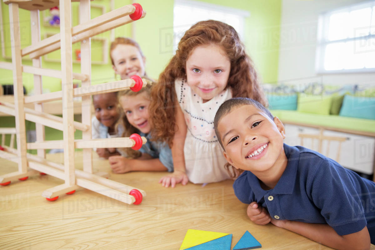 Students and teacher smiling in classroom - Royalty-free Stock Photo ...
