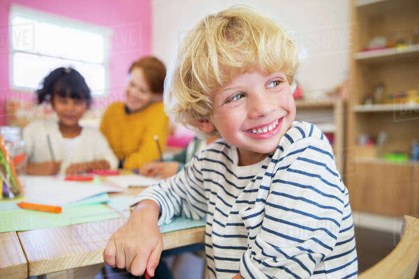 Student smiling in classroom - Royalty-free Stock Photo | Dissolve
