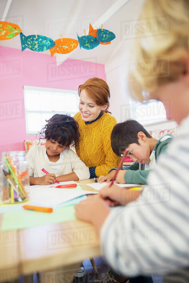 Students and teacher drawing in classroom - Royalty-free Stock Photo ...
