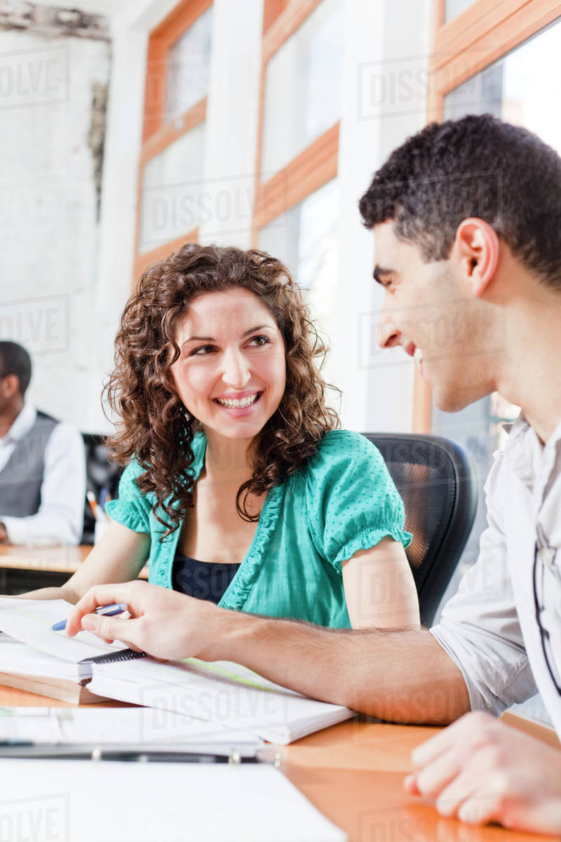 Business people talking in office - Stock Photo - Dissolve