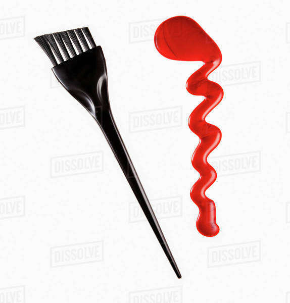 Red hair color and highlighting comb - Stock Photo - Dissolve