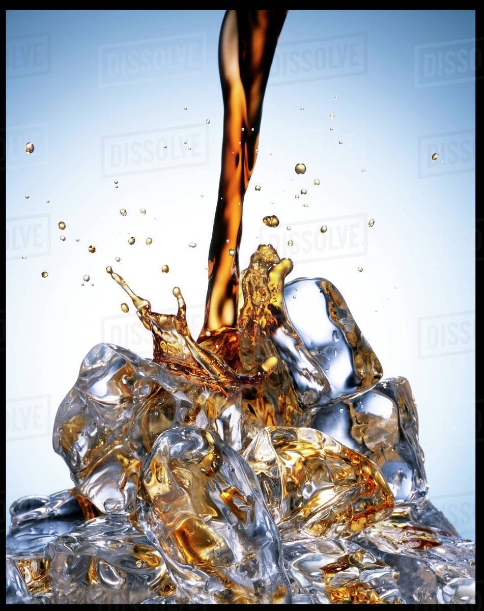 Soda pouring over ice - Royalty-free Stock Photo | Dissolve