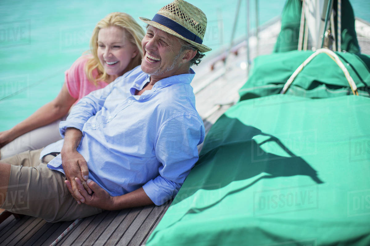 Couple sitting on boat together - Royalty-free Stock Photo | Dissolve