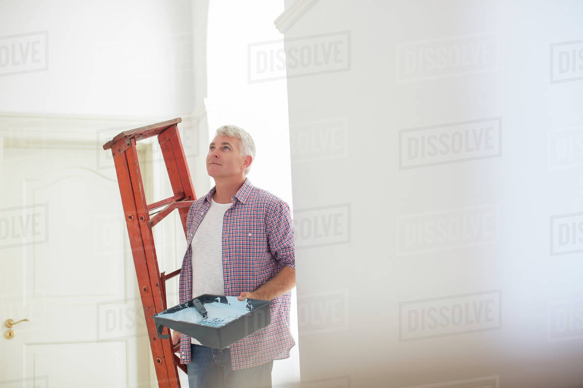 Older man carrying ladder and paint tray - Royalty-free Stock Photo ...