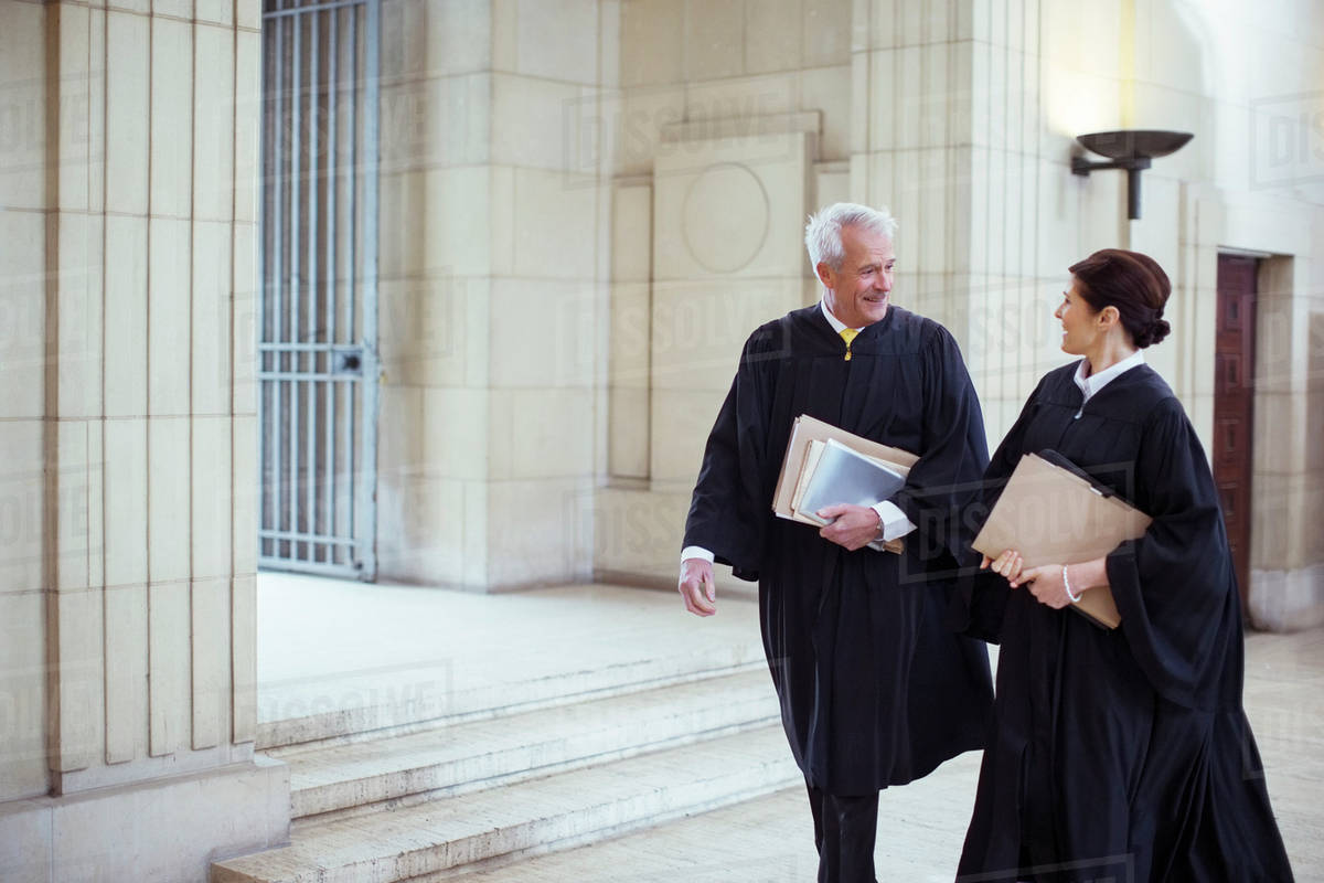 Judges walking through courthouse together - Royalty-free Stock Photo ...
