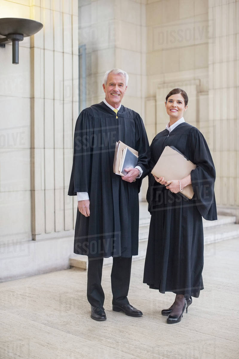 Judges standing together in courthouse - Royalty-free Stock Photo ...