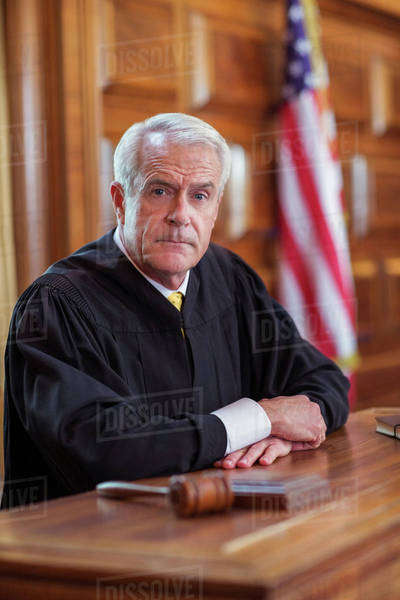 Judge sitting at judges bench in court - Royalty-free Stock Photo ...