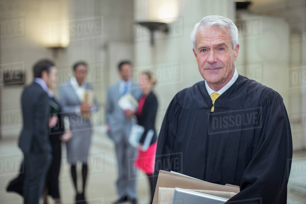 Judge holding legal documents in courthouse - Royalty-free Stock Photo ...