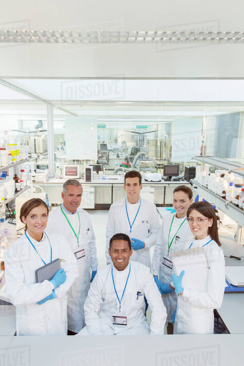 Scientists smiling in laboratory - Royalty-free Stock Photo | Dissolve
