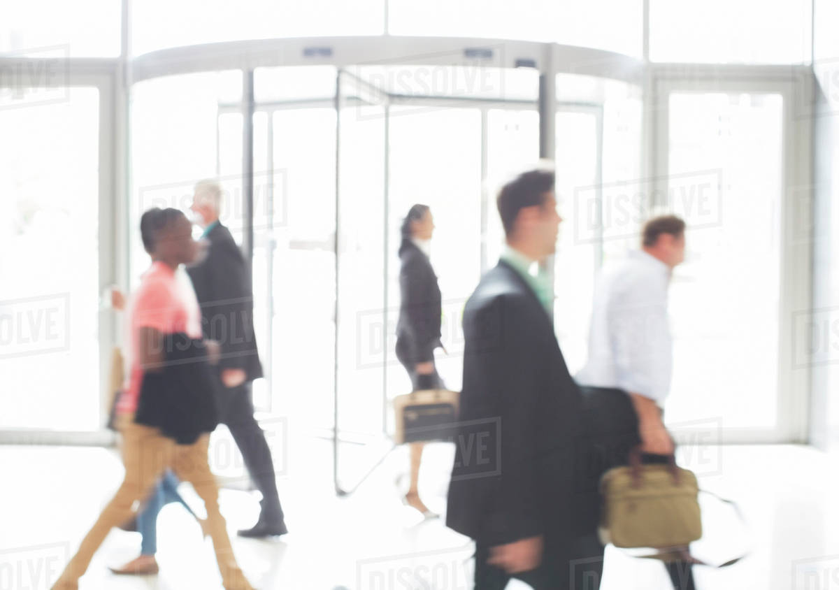 Business people walking in office - Royalty-free Stock Photo | Dissolve