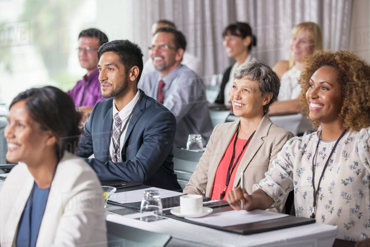 Group of people sitting and listening to speech during seminar - Stock ...