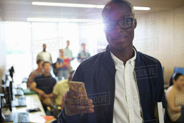 Portrait of university student with smartphone in classroom - Royalty ...