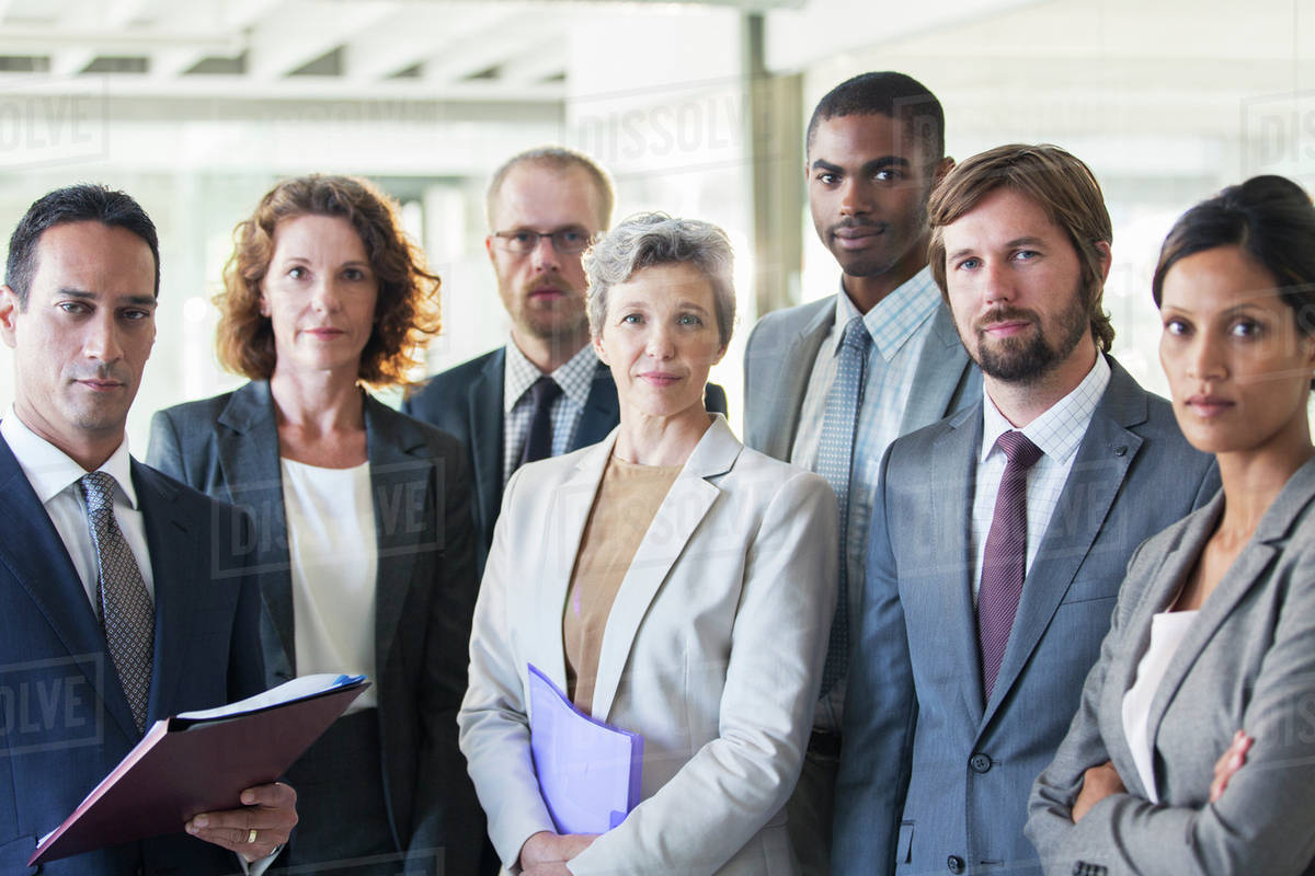 Group portrait of successful office team standing in office - Royalty ...