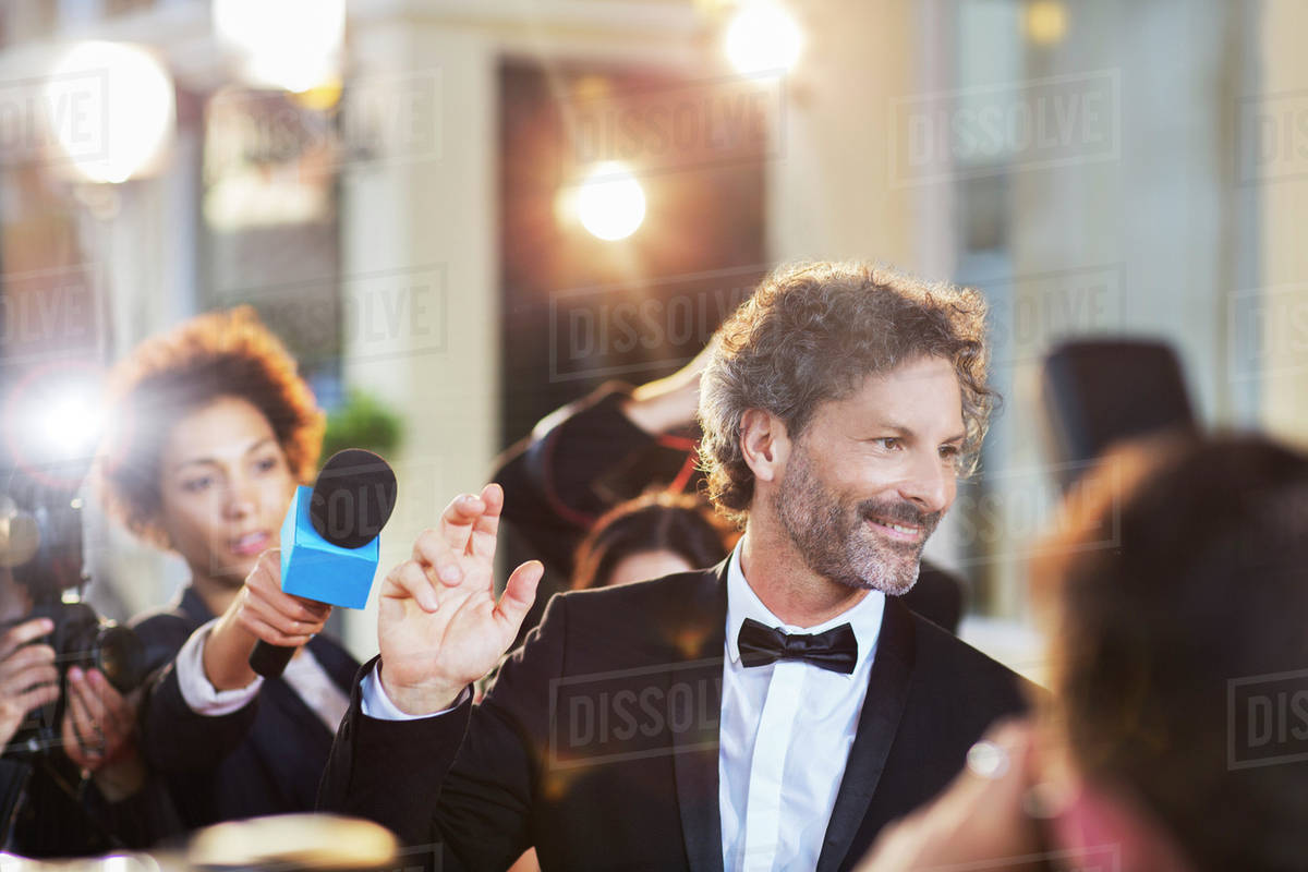 Celebrity waving to paparazzi at event - Royalty-free Stock Photo ...