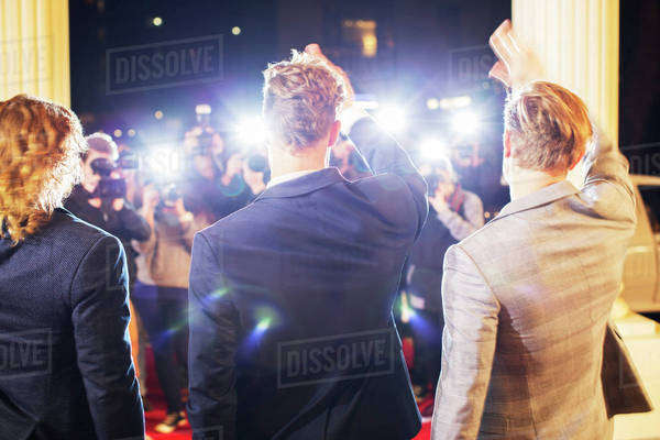 Celebrities waving and being photographed by paparazzi photographers at ...