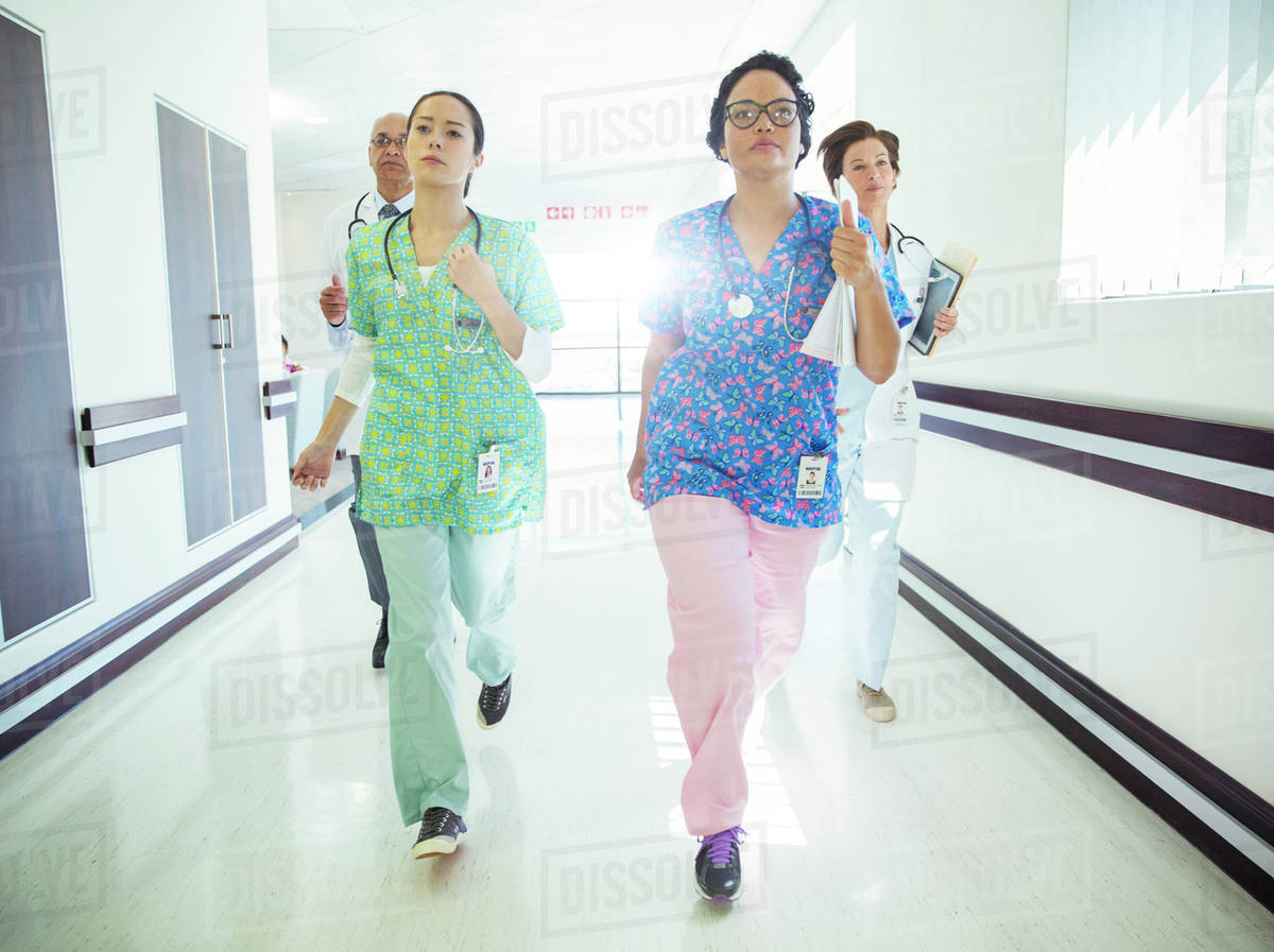 Doctors and nurses running down hospital corridor - Royalty-free Stock ...