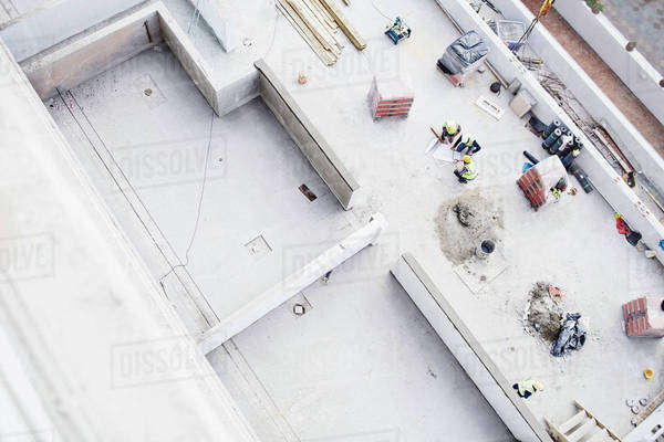 Overhead view of construction workers at construction site - Royalty ...
