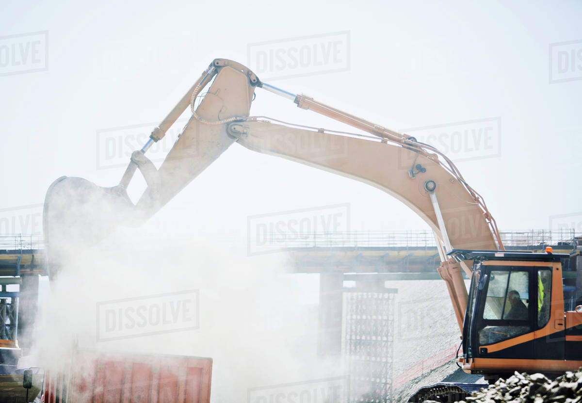Digger working on site - Royalty-free Stock Photo | Dissolve