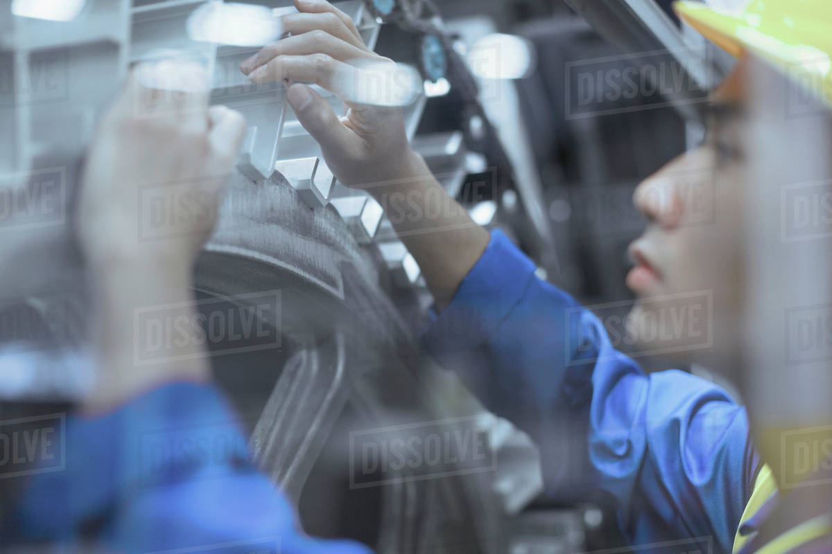 Engineer repairing machinery in factory - Royalty-free Stock Photo ...