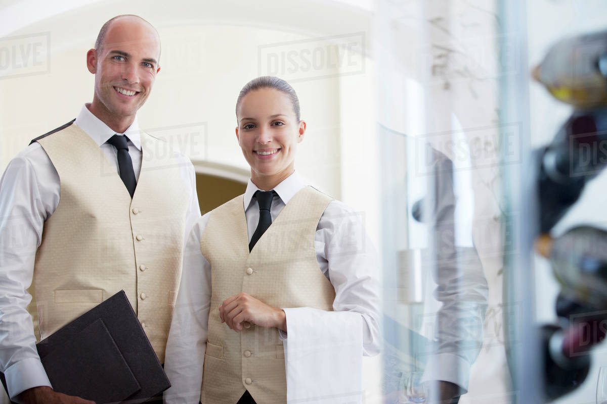 Wait staff smiling in restaurant - Royalty-free Stock Photo | Dissolve