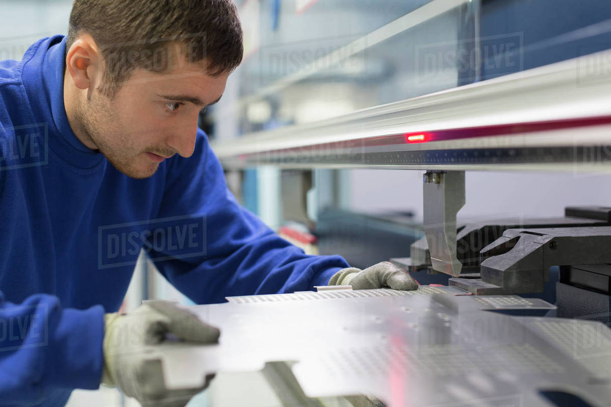 Worker operating laser cutter in steel factory - Royalty-free Stock ...