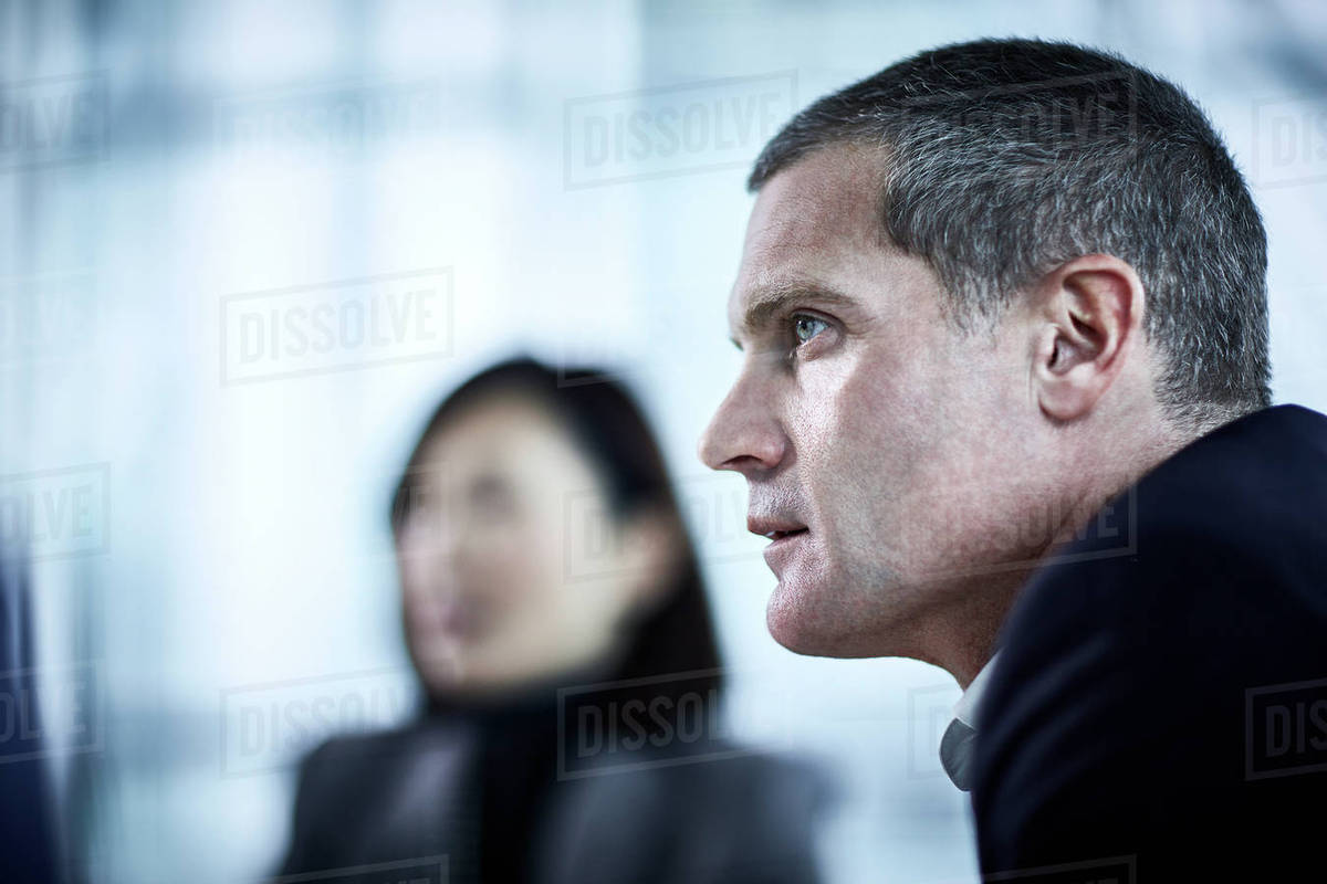 Attentive serious businessman listening in meeting - Royalty-free Stock ...